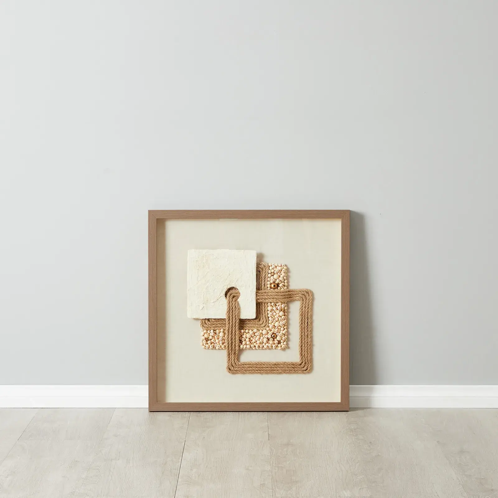 Feather Shadow Box with Light Brown Frame